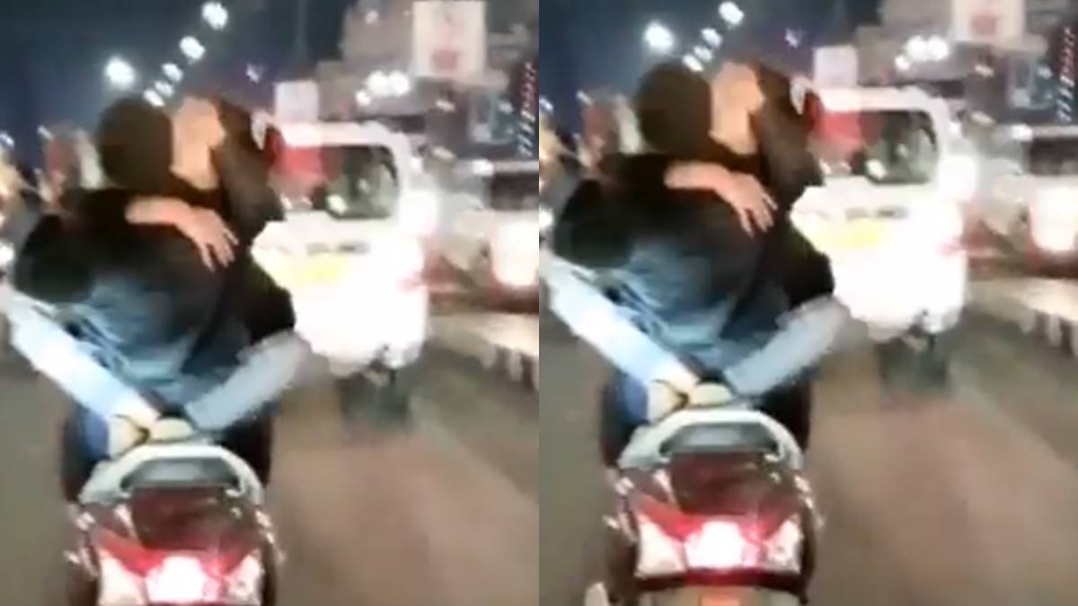 Video of couple romancing on scooty in Lucknow goes viral on social media - चलती स्कूटी पर इश्क ...