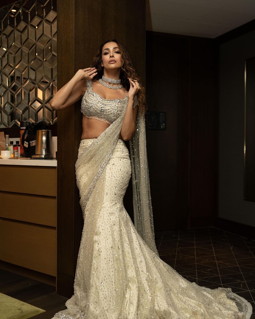 Malaika Arora in ivory tulle Swarovski saree by Manish Malhotra, you can also try it on Raksha ...