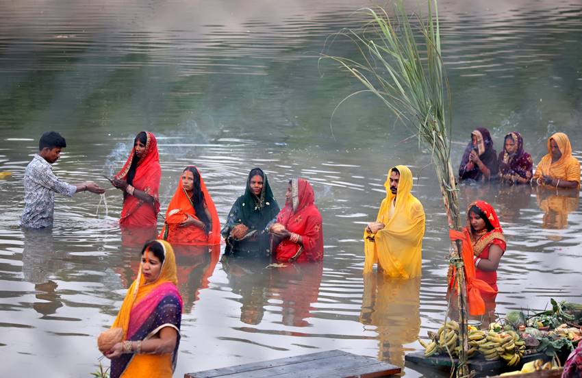 Why is arghya offered to the surya dev while standing in water on ...